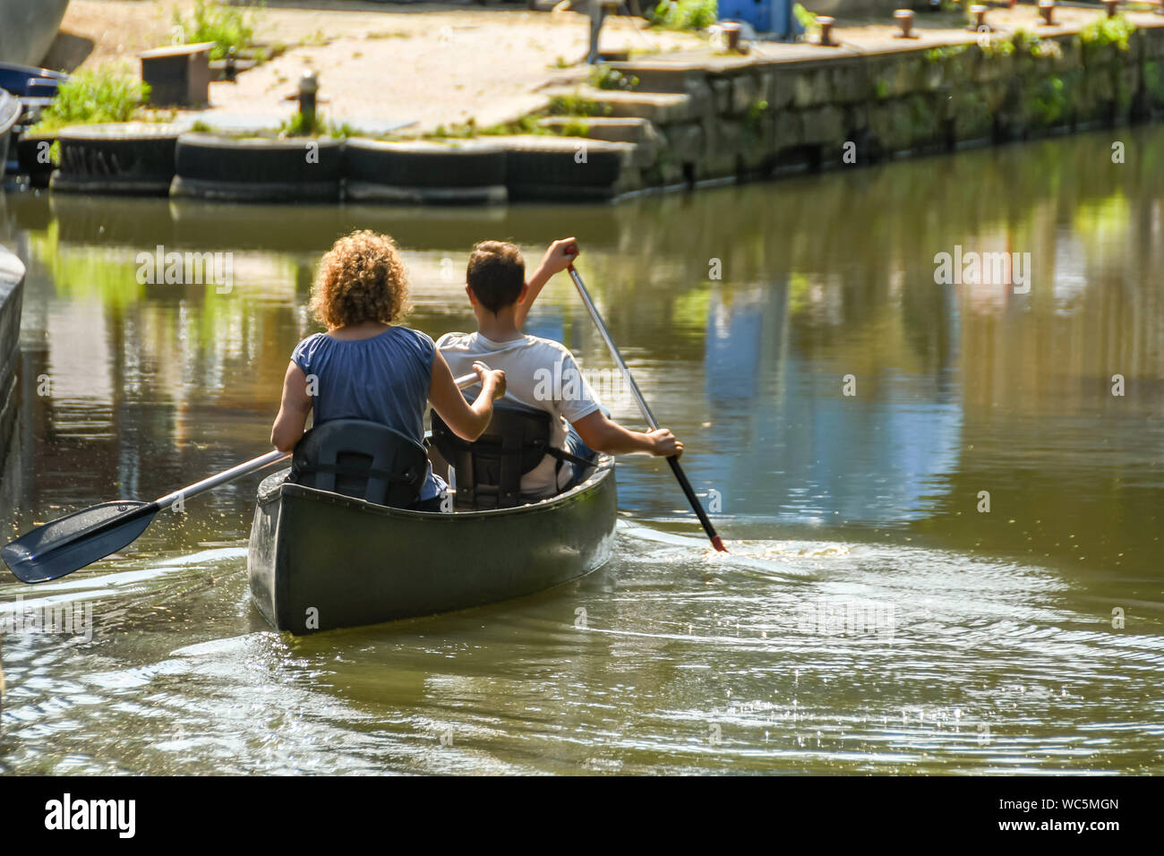 BATH, ENGLAND - JULY 2019: People paddling a canoe on the Somerset Coal ...