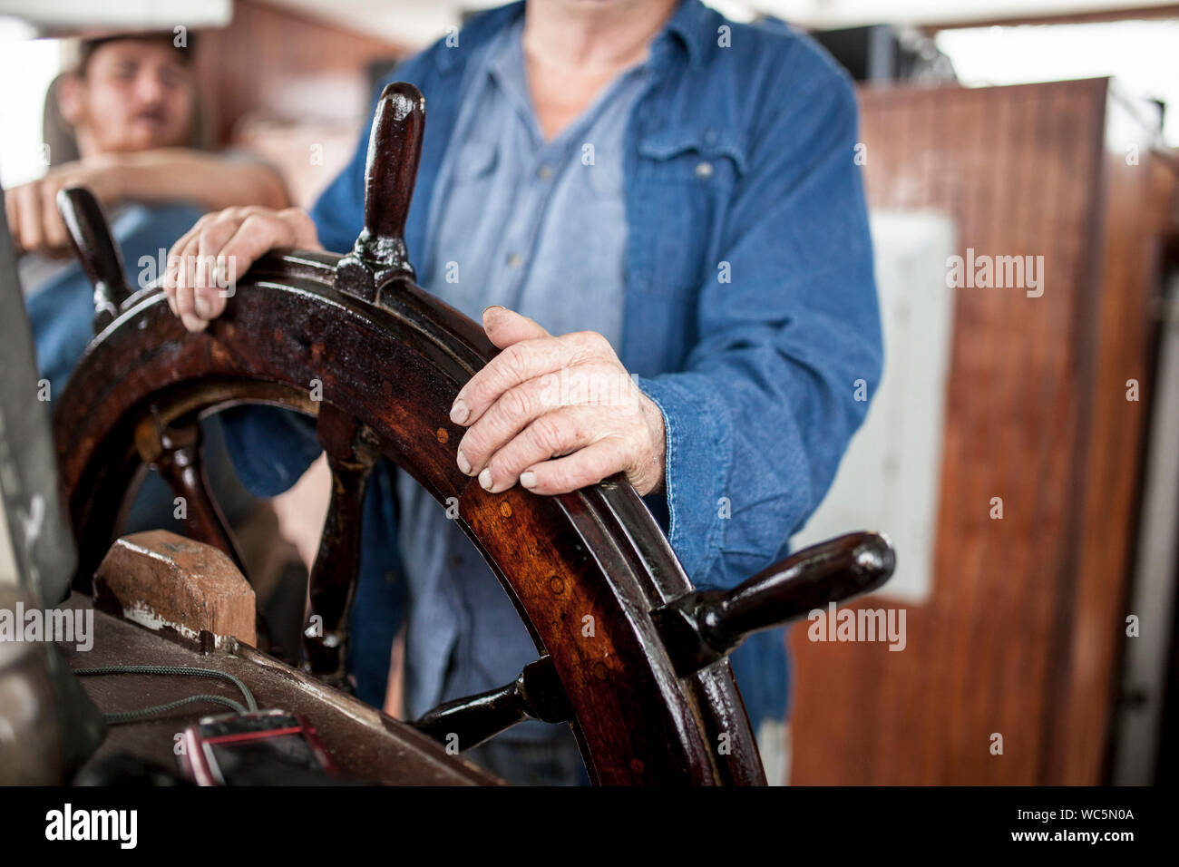 detail of captain's hands on fishing vessel Stock Photo - Alamy