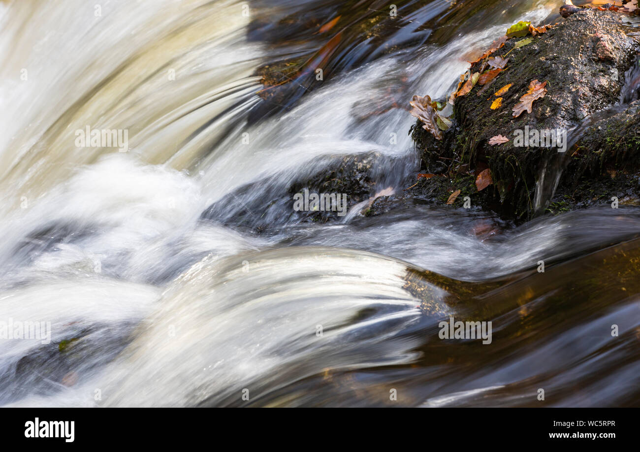 fast flowing stream Stock Photo - Alamy