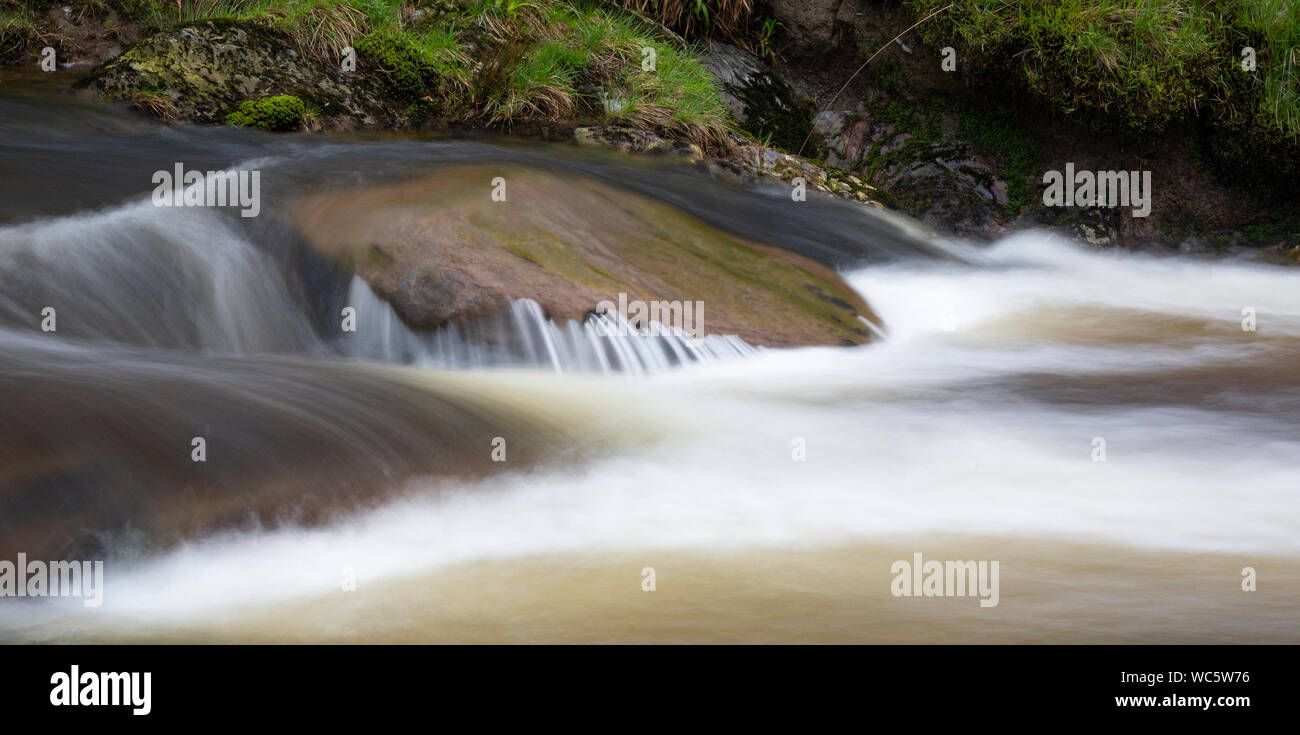 fast flowing stream Stock Photo - Alamy