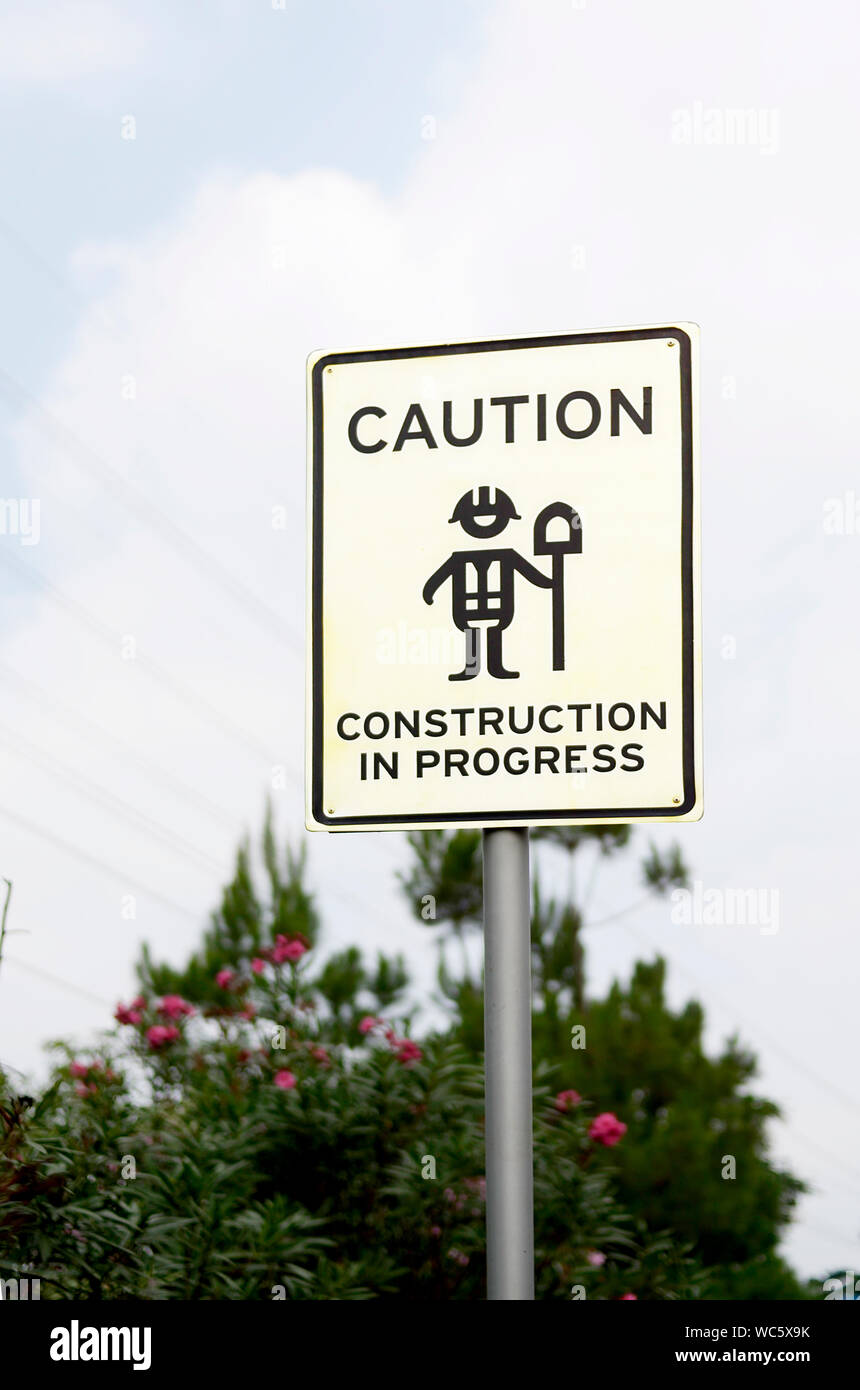 signage caution Construction in progress Stock Photo - Alamy