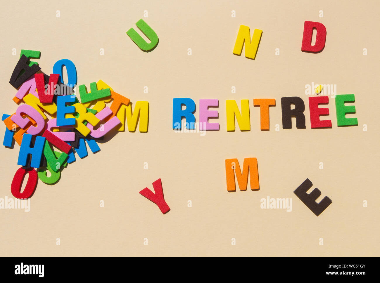 Back to school written in french language with colored letters and heap ...