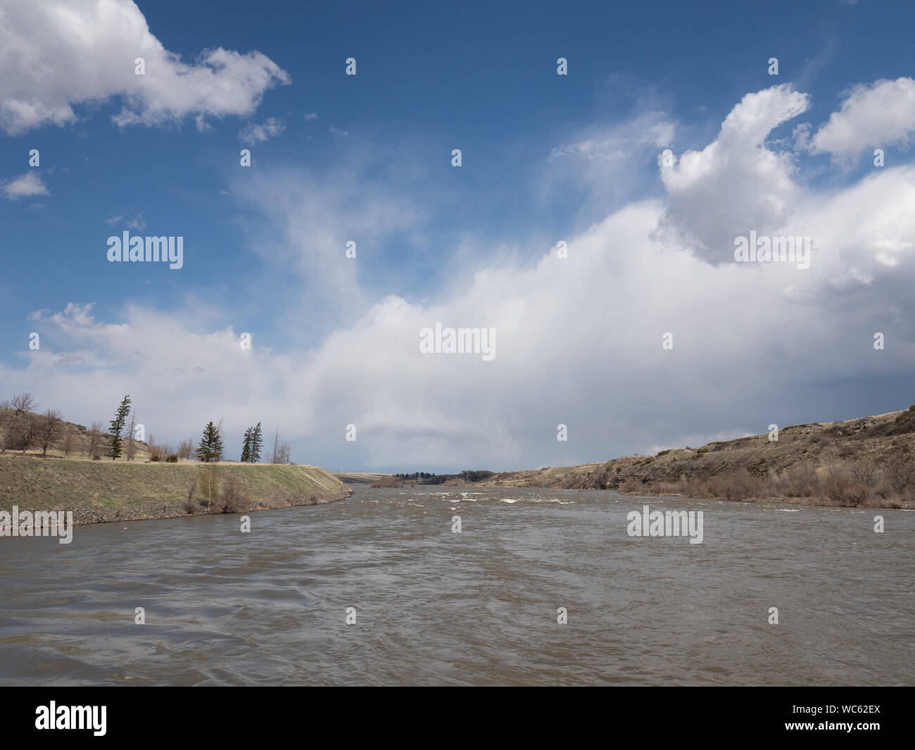 The gray-brown Missouri River and barren river banks photographed at ...