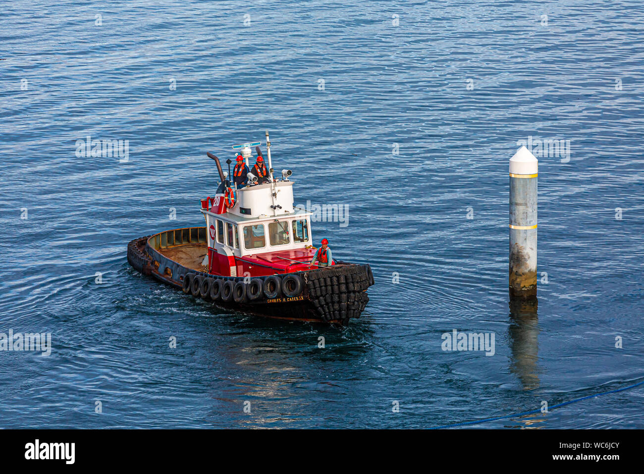A tugboat in blue water Stock Photo - Alamy