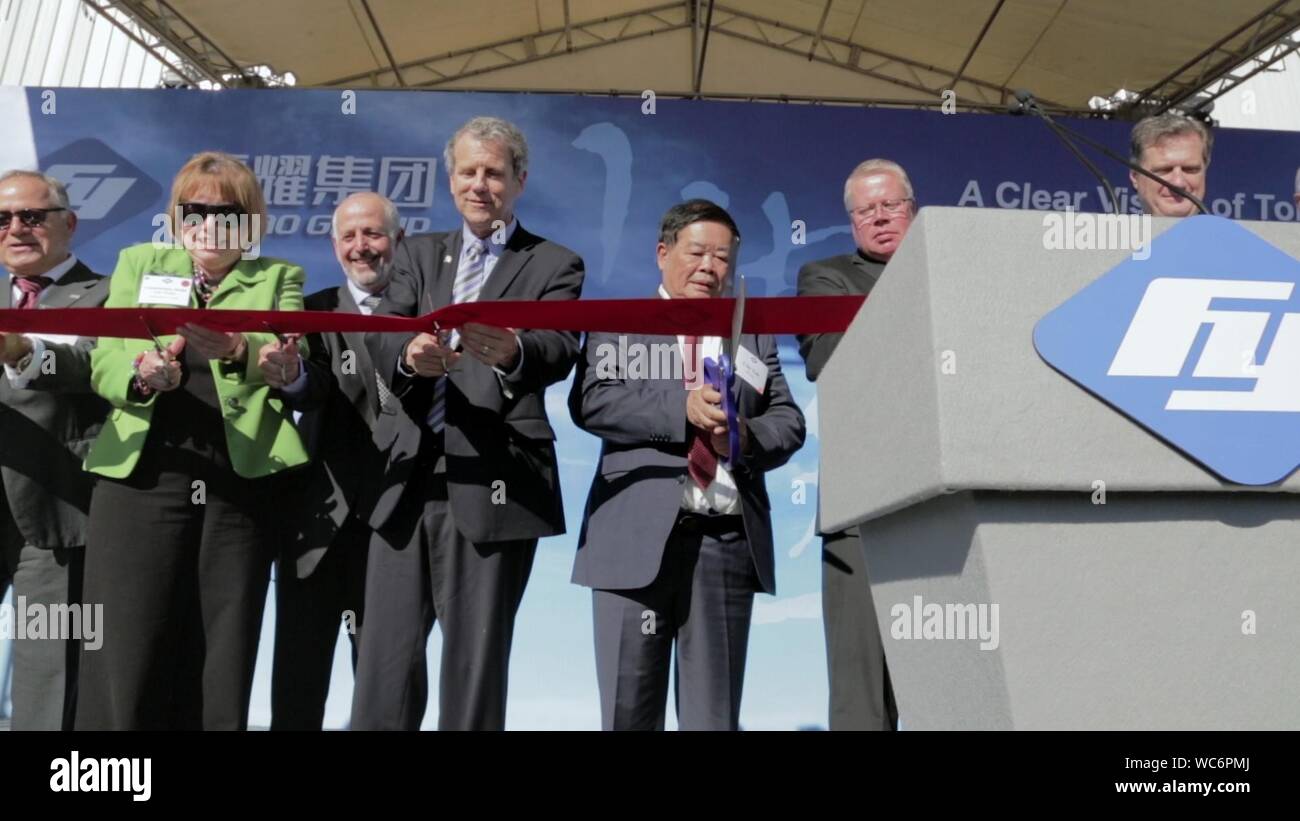 AMERICAN FACTORY, Chairman Cao Dewang (center) cutting ribbon at ...