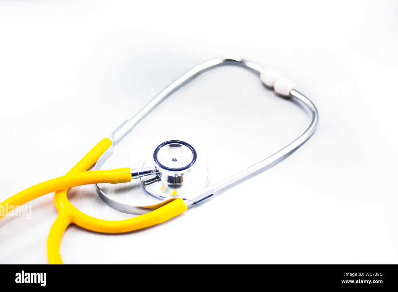 Yellow Stethoscope On White Background Stock Photo - Alamy