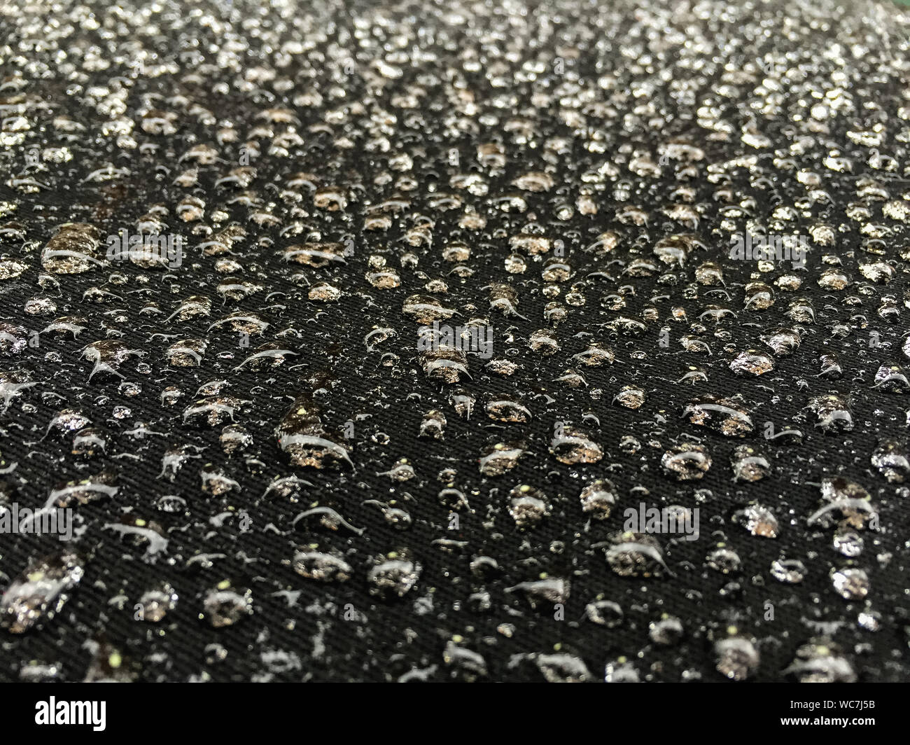 Water drops and fabric hi-res stock photography and images - Alamy