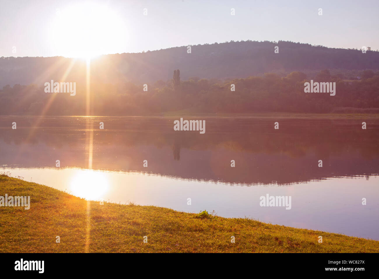 morning scenery with sunrise over the lake Stock Photo - Alamy