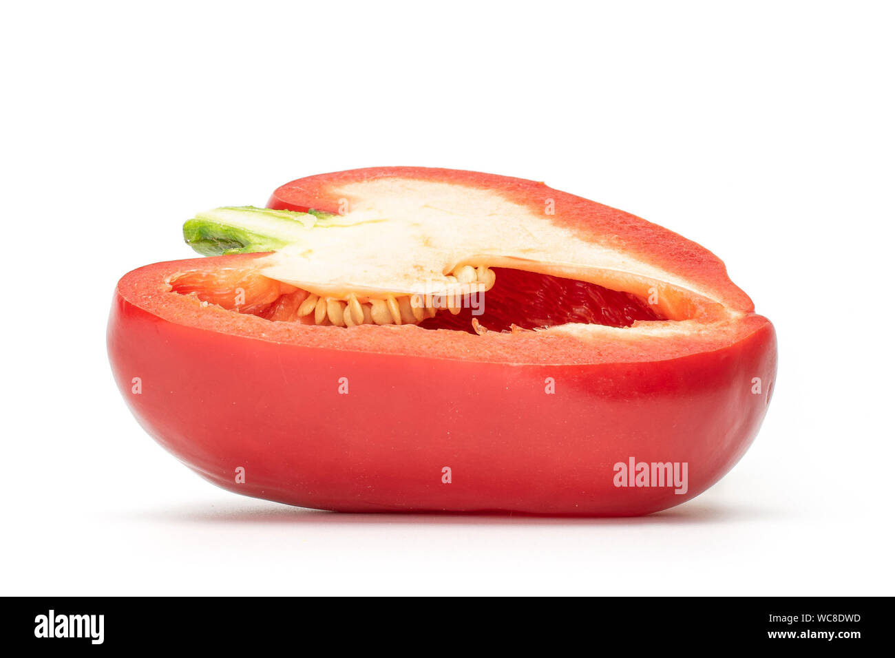 One half of red bell pepper isolated on white background Stock Photo ...