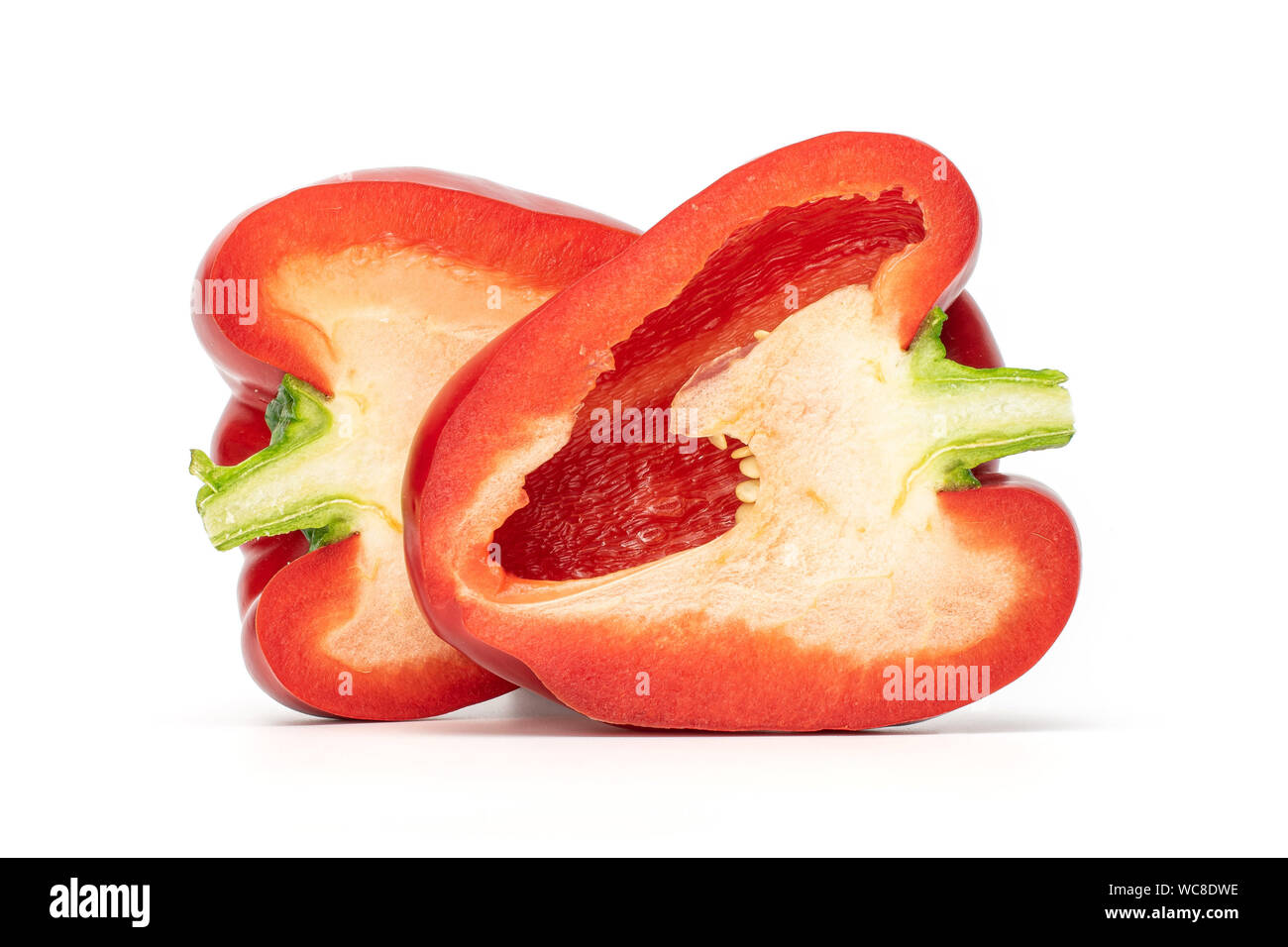 Group of two halves of red bell pepper isolated on white background ...