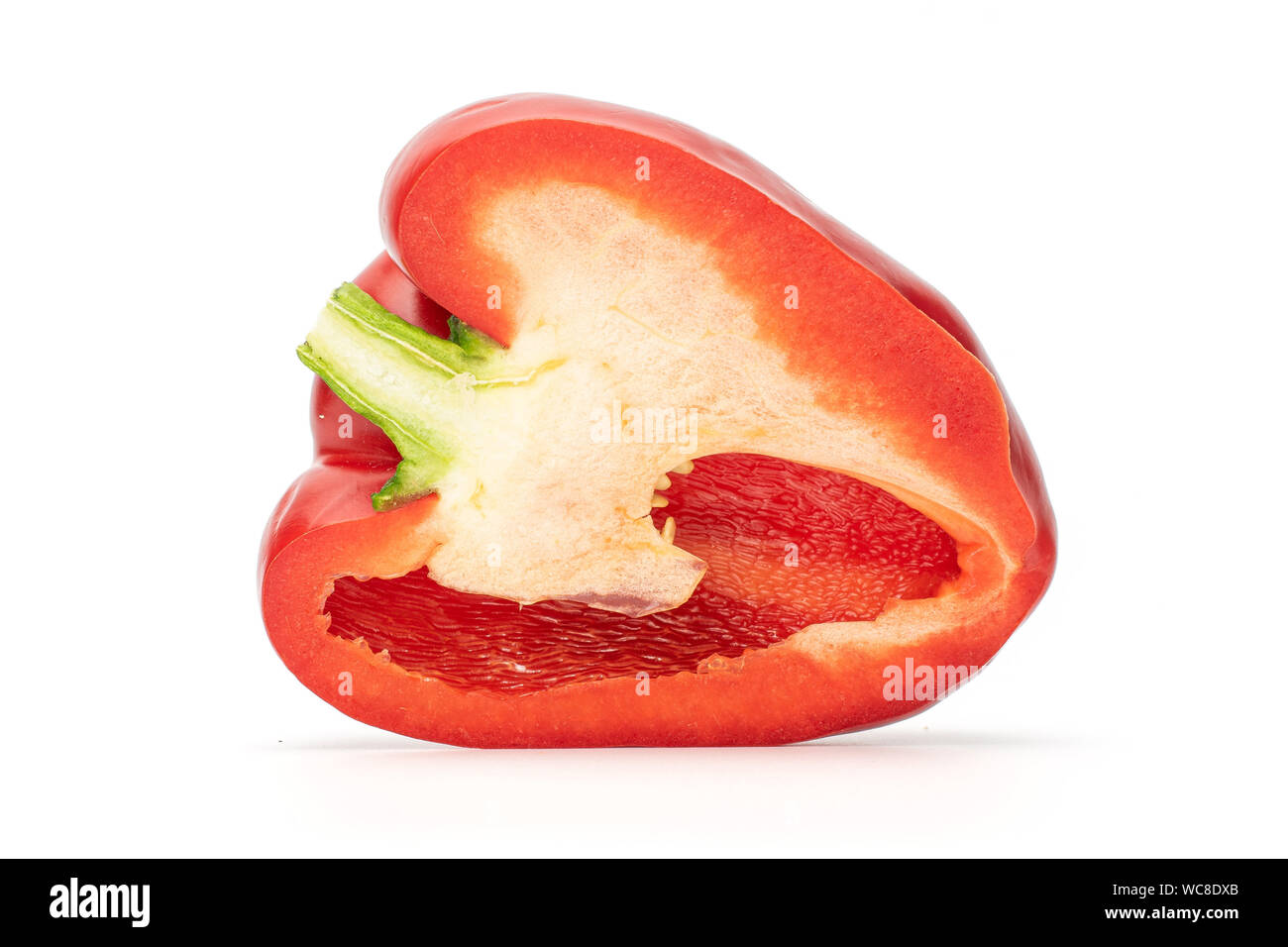 One half of red bell pepper cross section isolated on white background ...