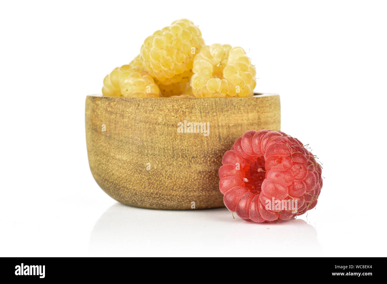 Lot of whole fresh golden hymalayan raspberry with one red berry in ...