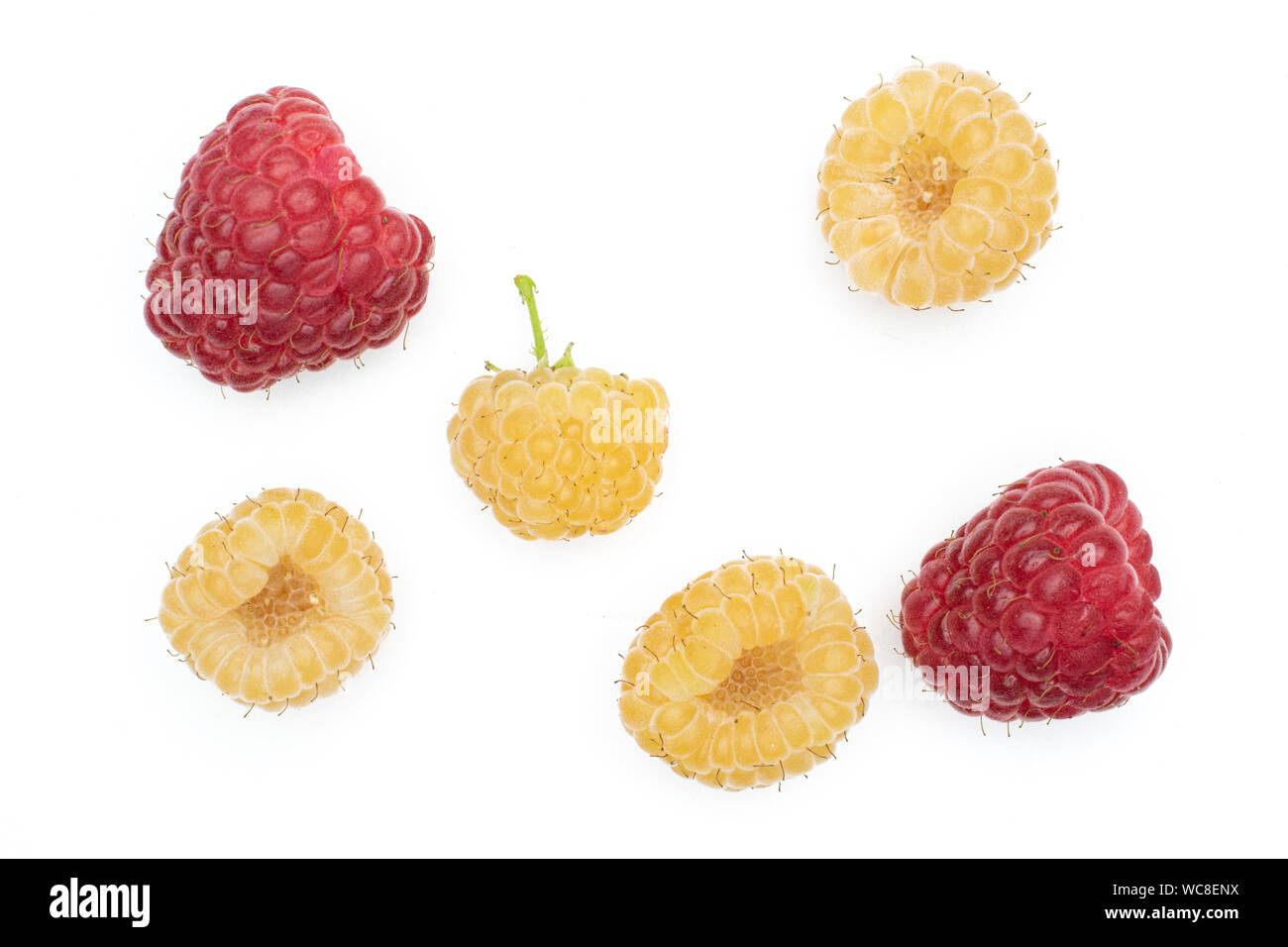 Group of four whole fresh golden hymalayan raspberry with two red ...