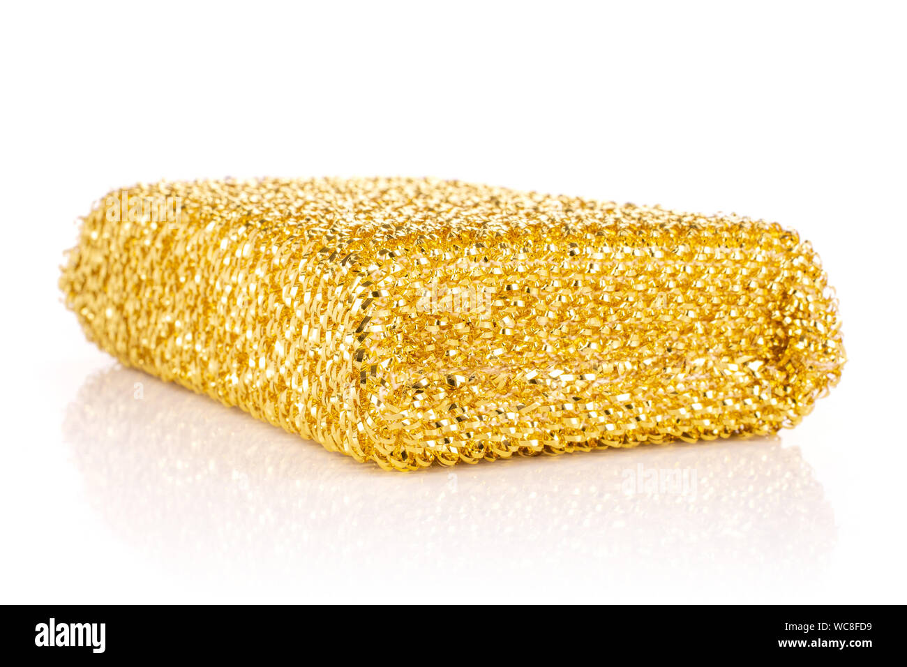 One whole golden cleaning kitchen sponge isolated on white background ...