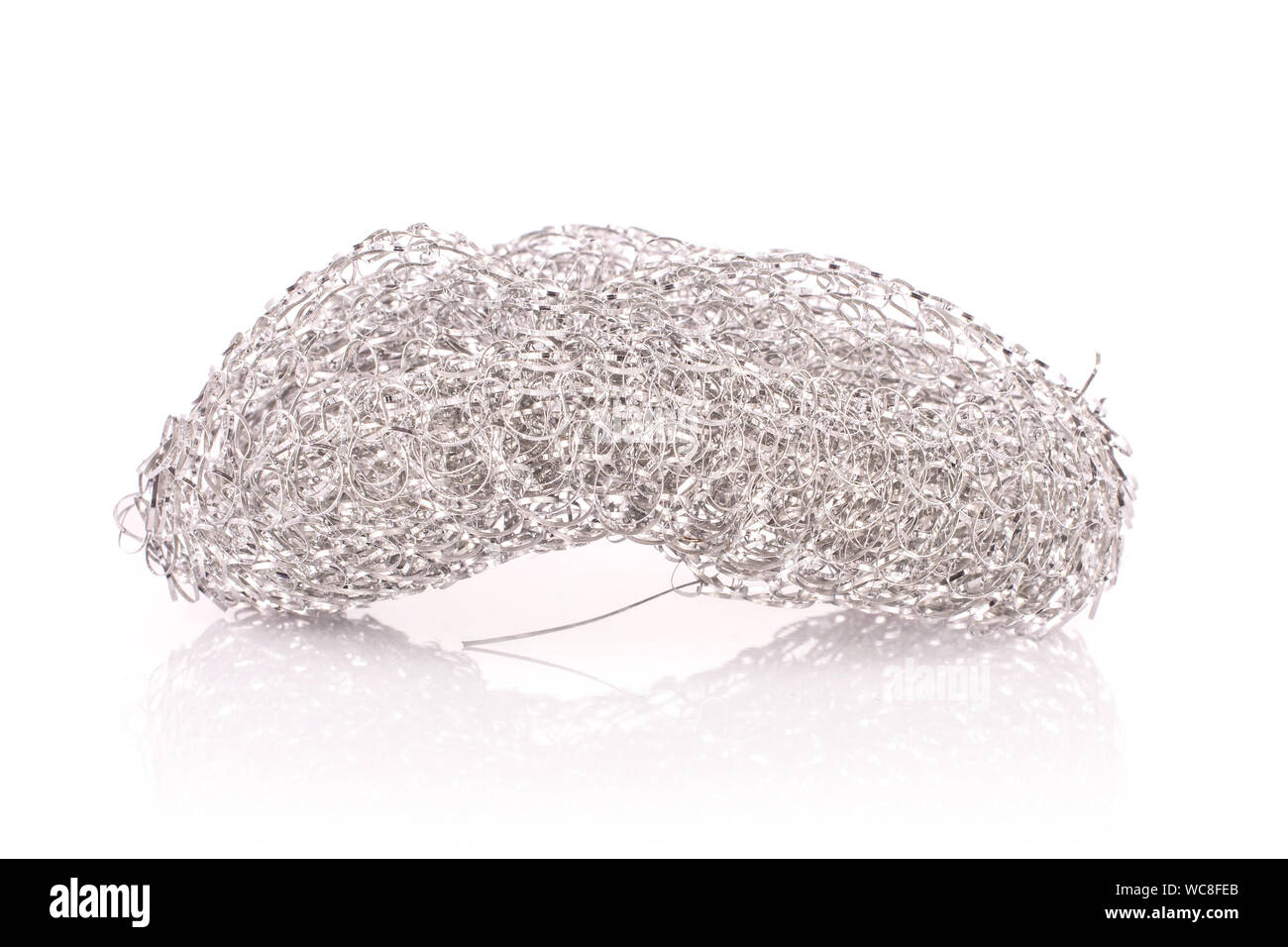 One whole iron cleaning kitchen sponge isolated on white background ...