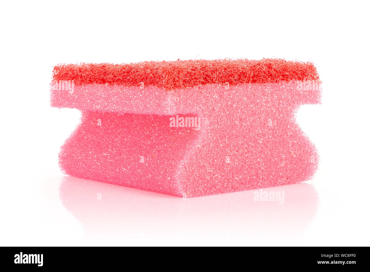 One whole pink cleaning kitchen sponge letter shape isolated on white ...