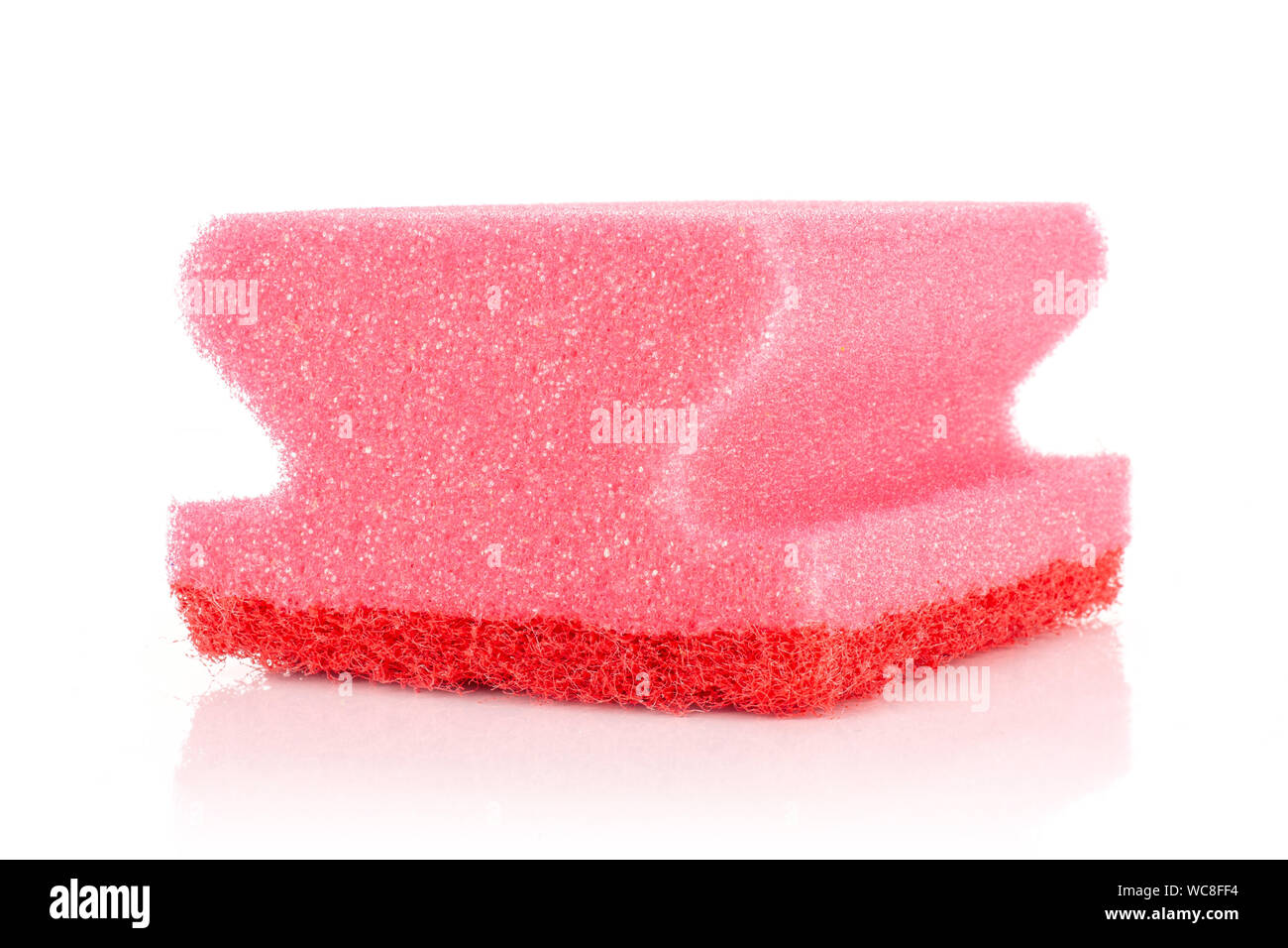 One whole pink cleaning kitchen sponge letter shape isolated on white ...