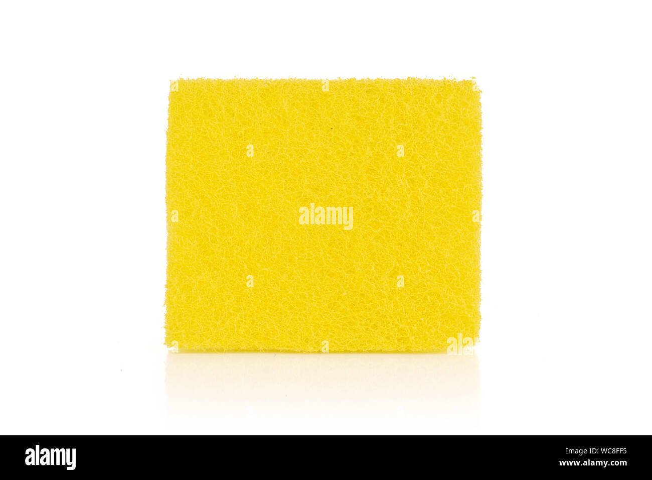 One whole yellow cleaning kitchen sponge isolated on white background ...