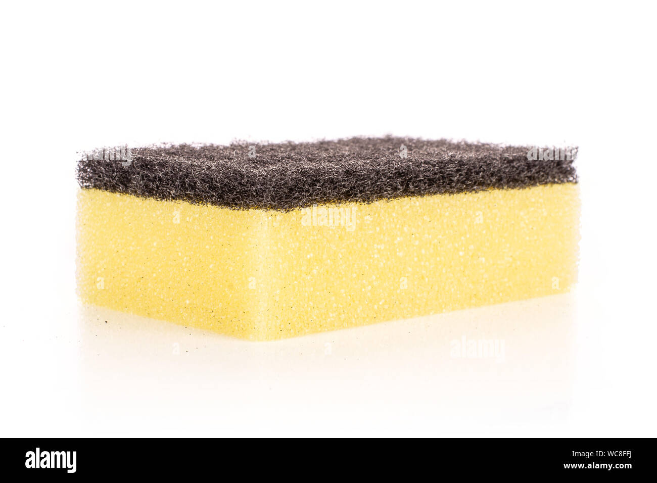 One whole yellow cleaning kitchen sponge isolated on white background ...