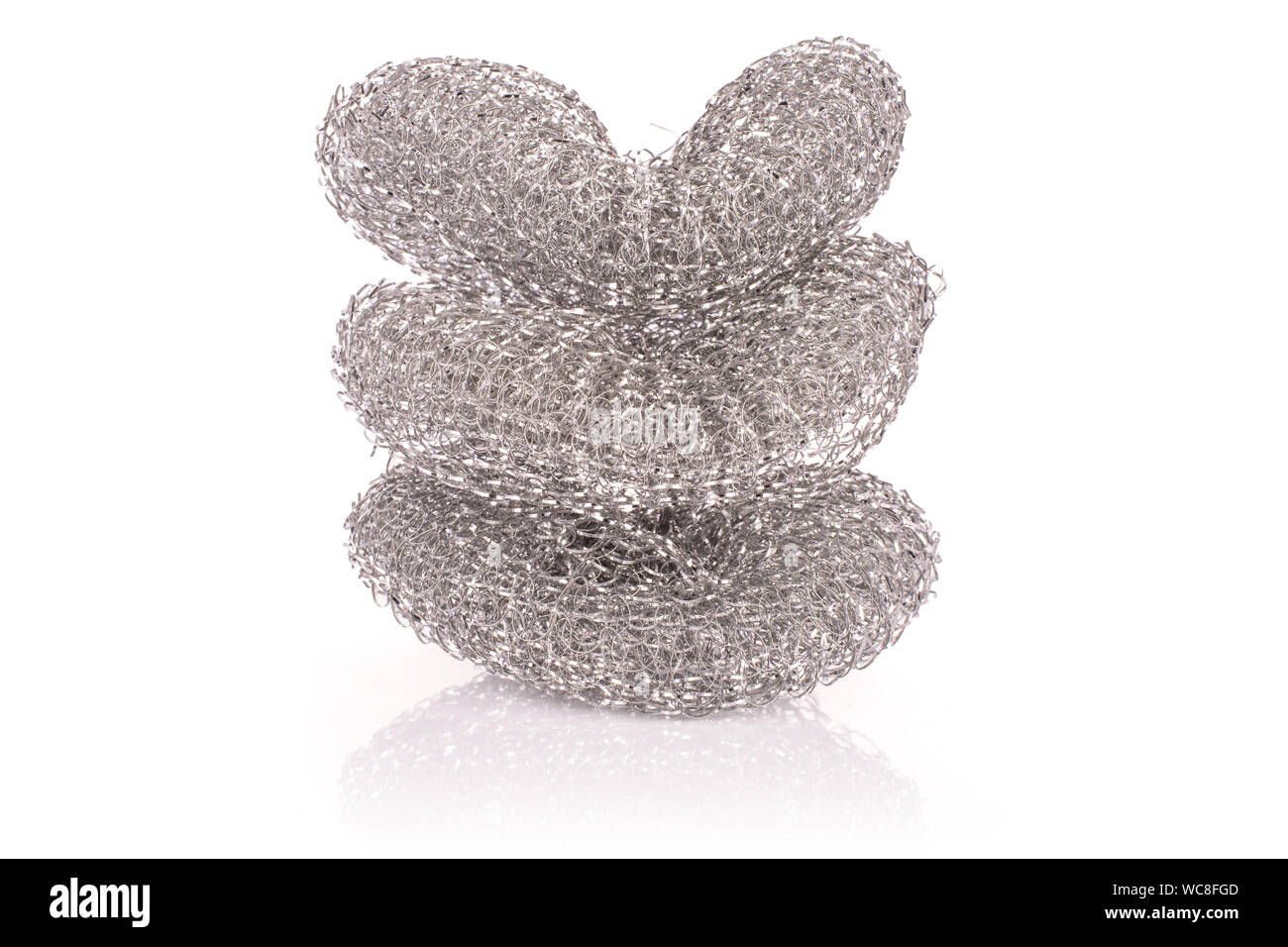 Group of three whole metal cleaning kitchen sponge isolated on white ...