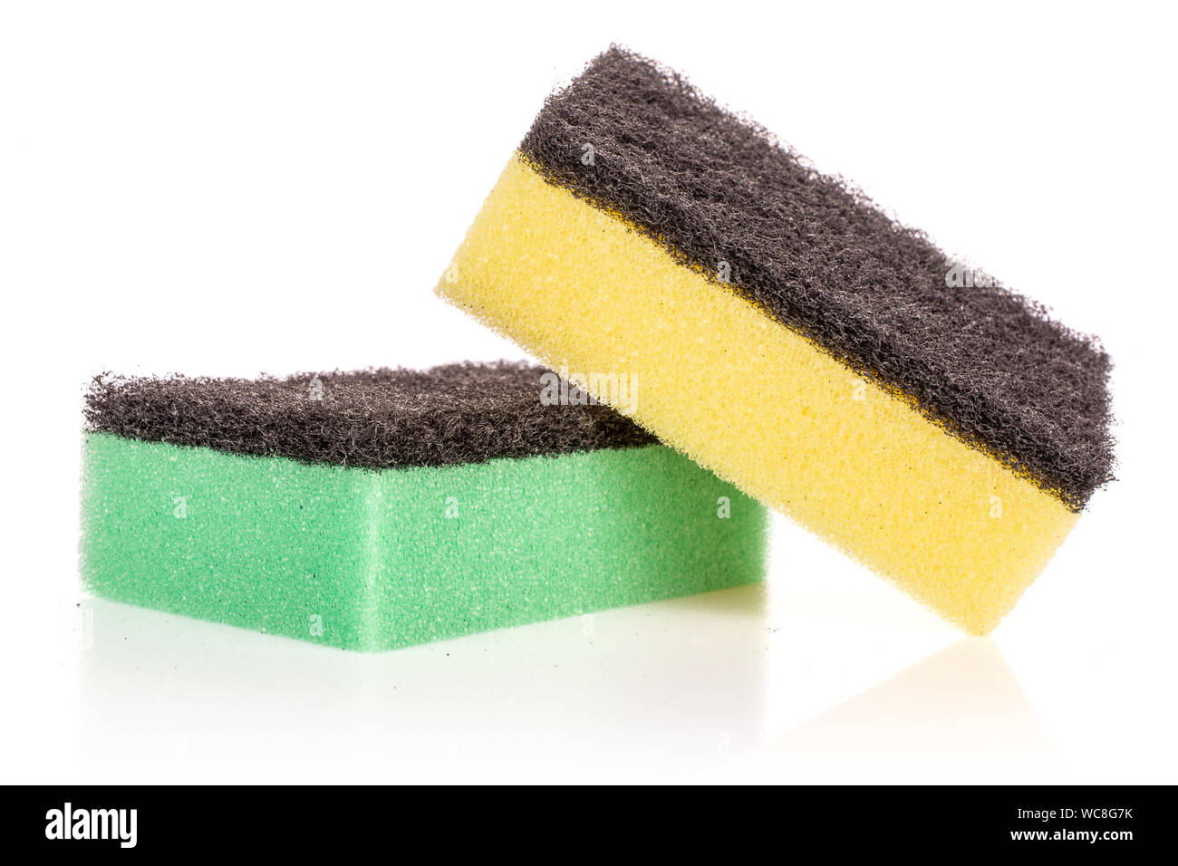 Group of two whole cleaning kitchen sponge green yellow isolated on ...