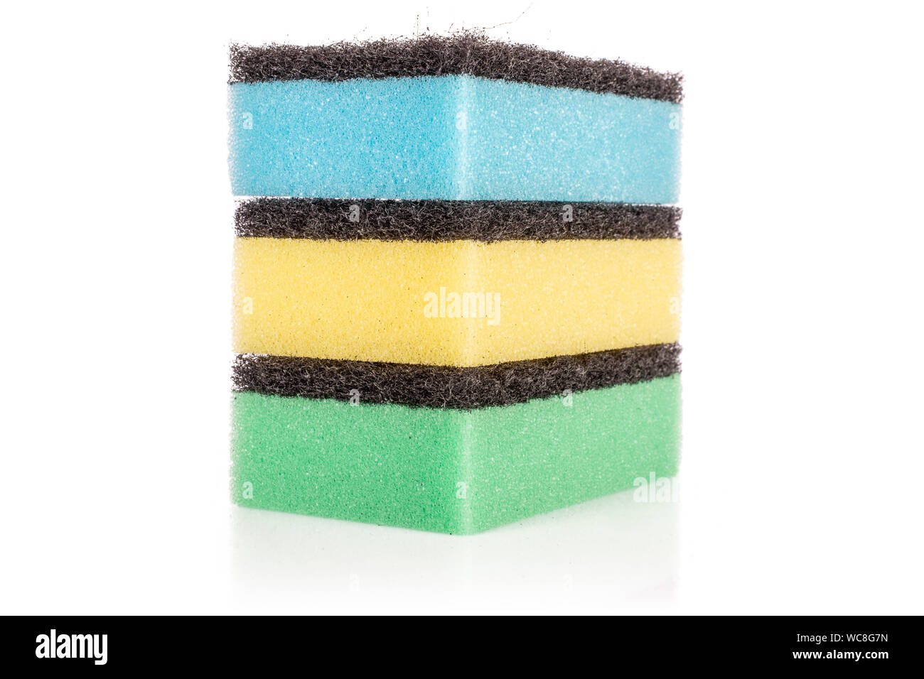 Group of three whole cleaning kitchen sponge one on top of another ...