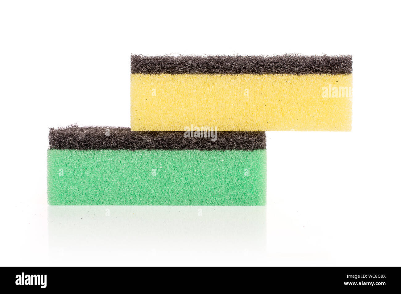 Group of two whole green and yellow cleaning kitchen sponge isolated on ...