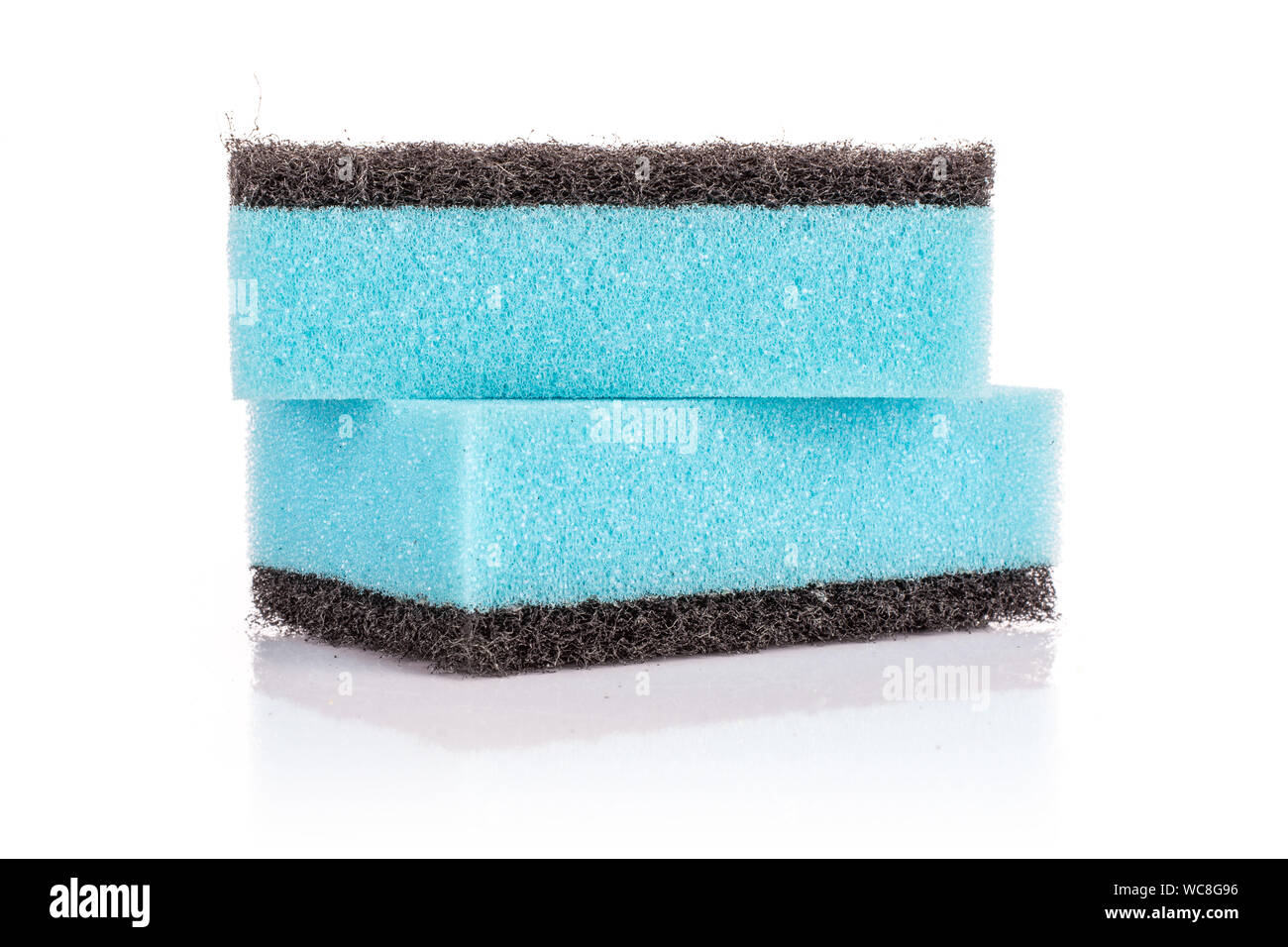 Group of two whole blue cleaning kitchen sponge isolated on white ...