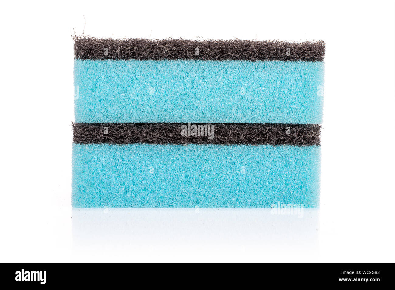 Group of two whole blue cleaning kitchen sponge isolated on white ...
