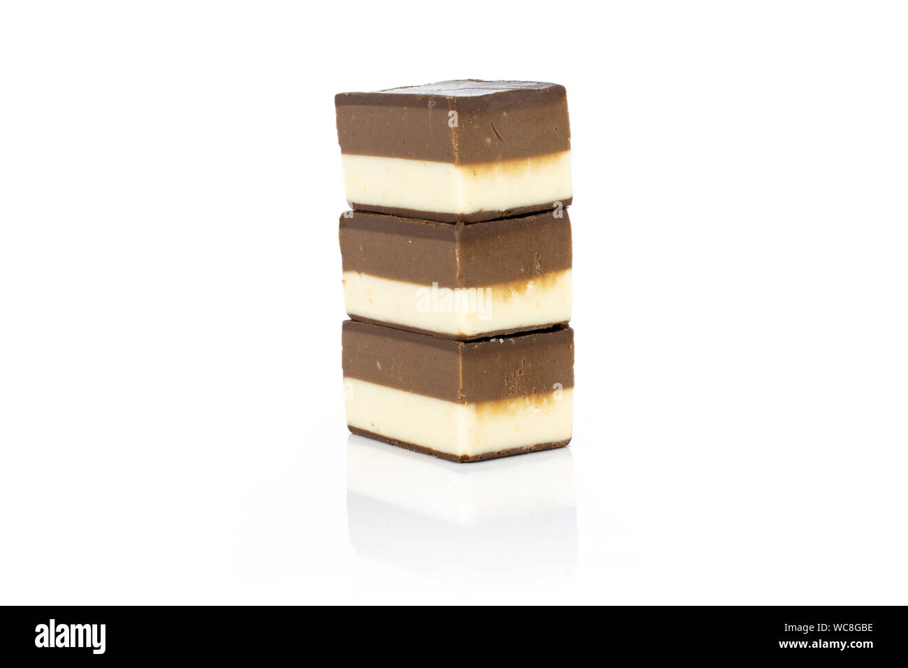 Group of three whole mellow two coloured nougat piece one on top of ...