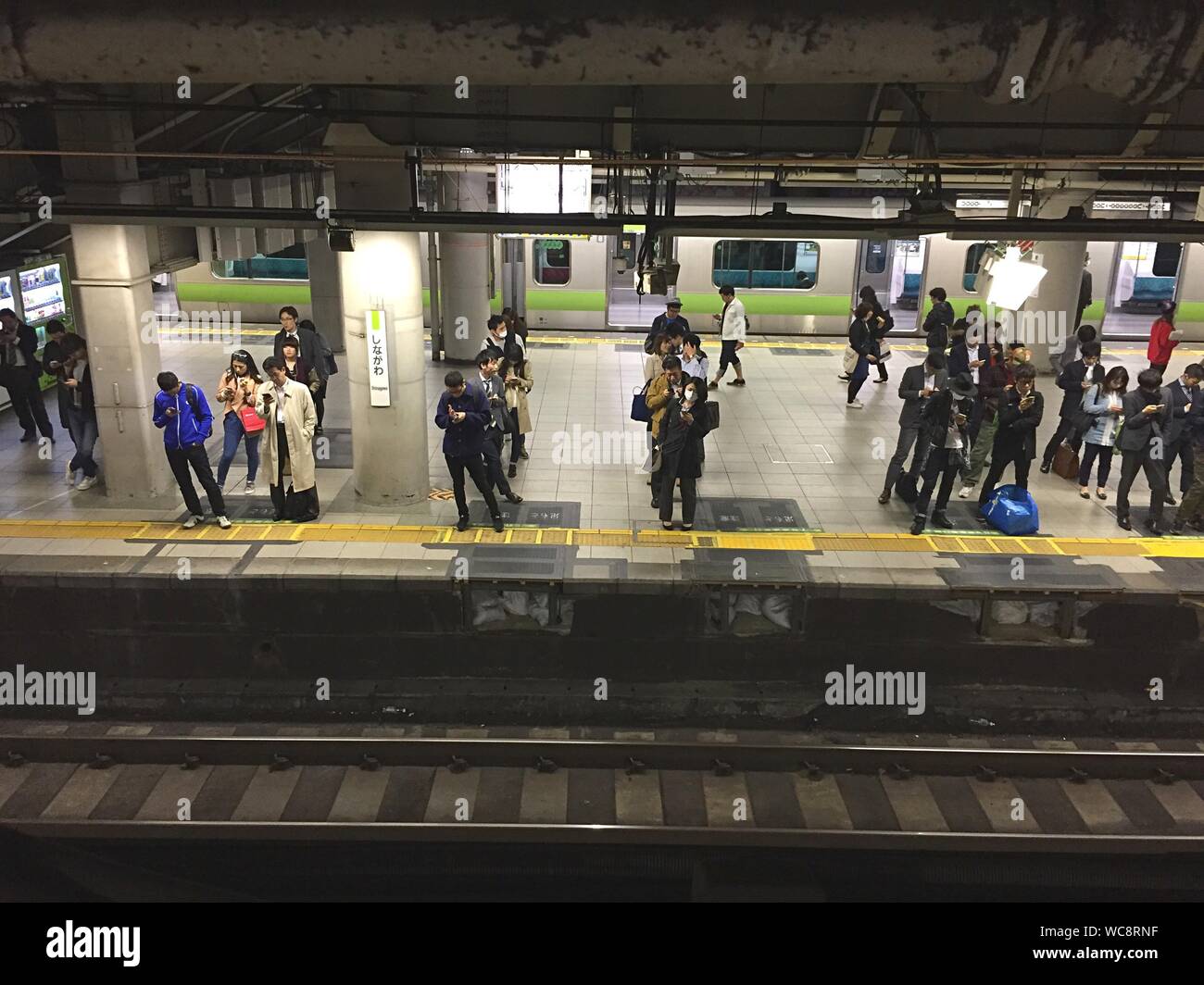 Passengers waiting for subway hi-res stock photography and images - Alamy
