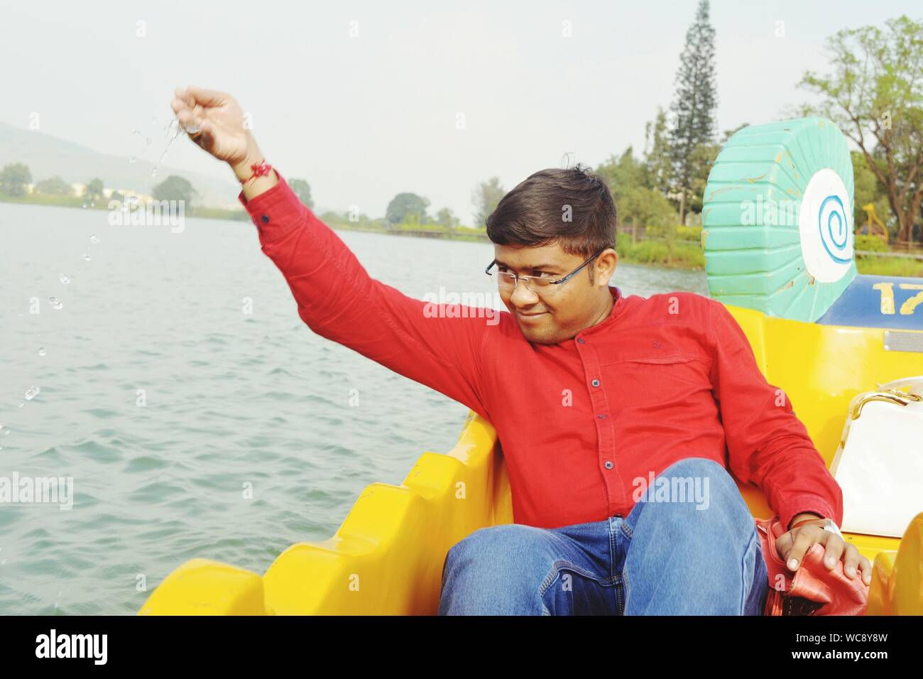 Indian man sitting on boat hi-res stock photography and images - Alamy