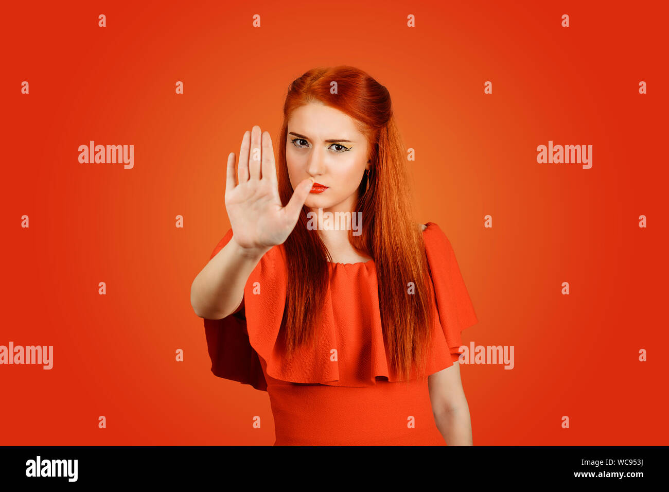 Pretty teen girl, young woman making a gesture stop with her hand ...