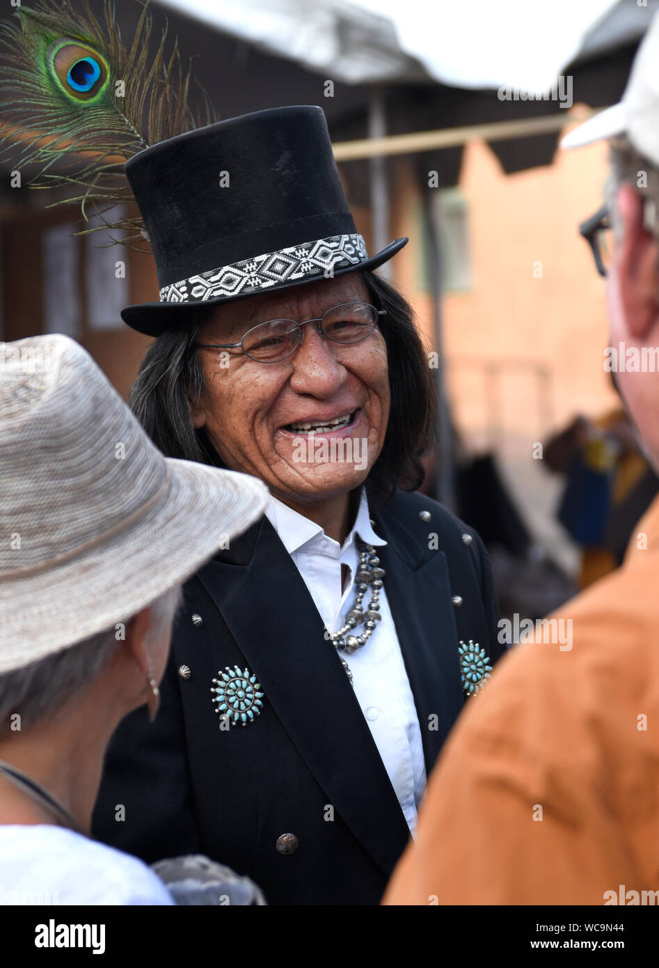 Darrell Jumbo, A Navajo jewelry artist, talks with visitors at the the ...