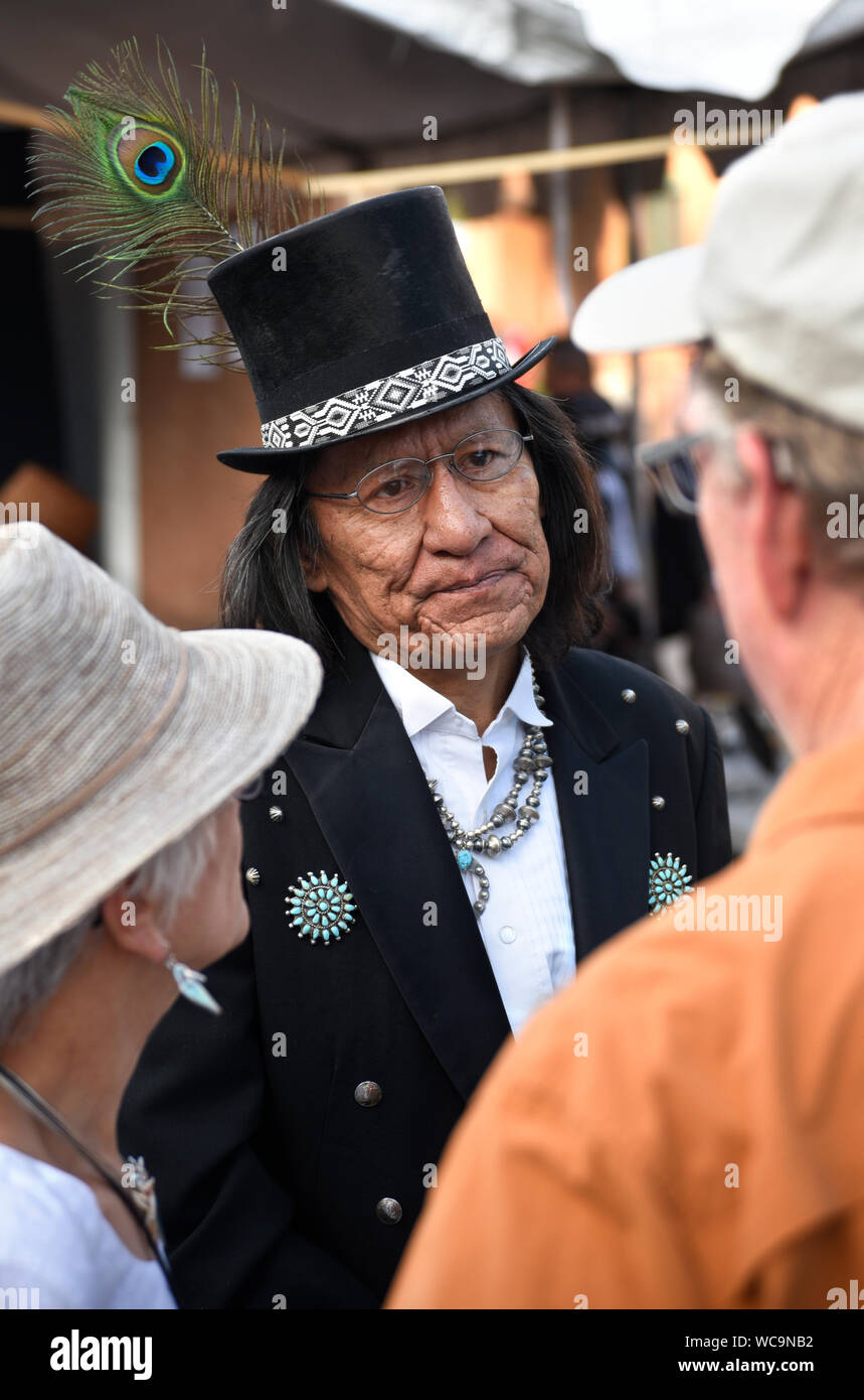 Darrell Jumbo, A Navajo jewelry artist, talks with visitors at the the ...