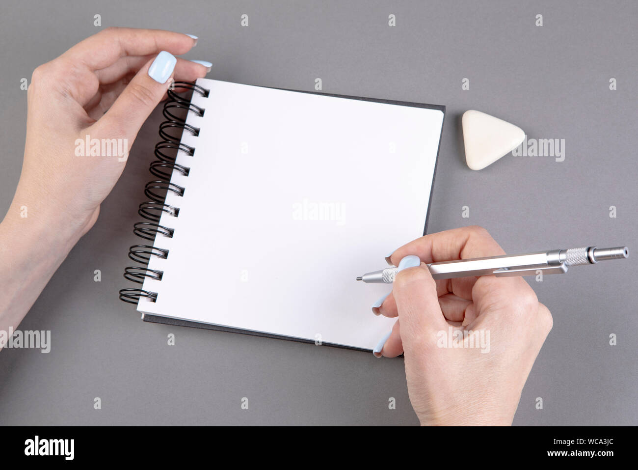 Woman hand with pencil prepare to writing on notebook Stock Photo - Alamy