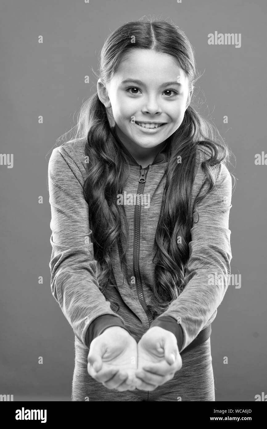 Look here. Kid happy smiling face show something in both hands copy ...