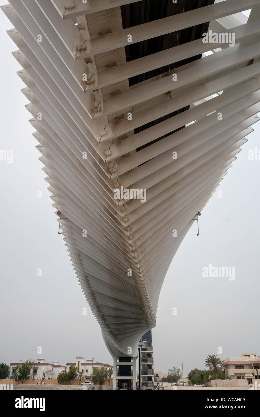 The iconic twisted pedestrian bridge over the Dubai Water Canal in ...