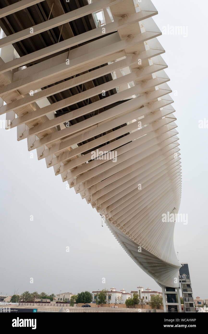 The iconic twisted pedestrian bridge over the Dubai Water Canal in ...