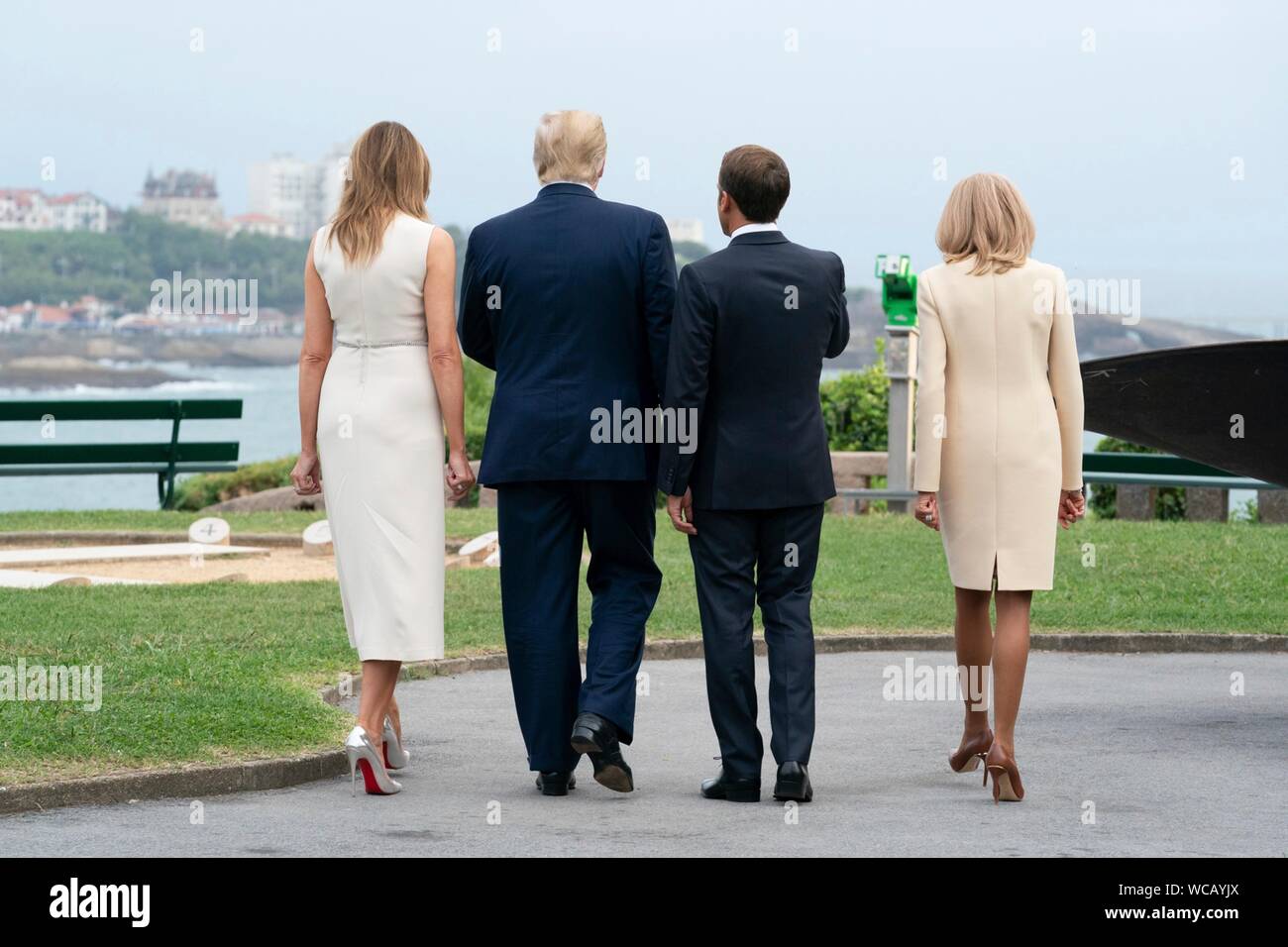 U.S. President Donald Trump and French President Emmanuel Macron walk ...