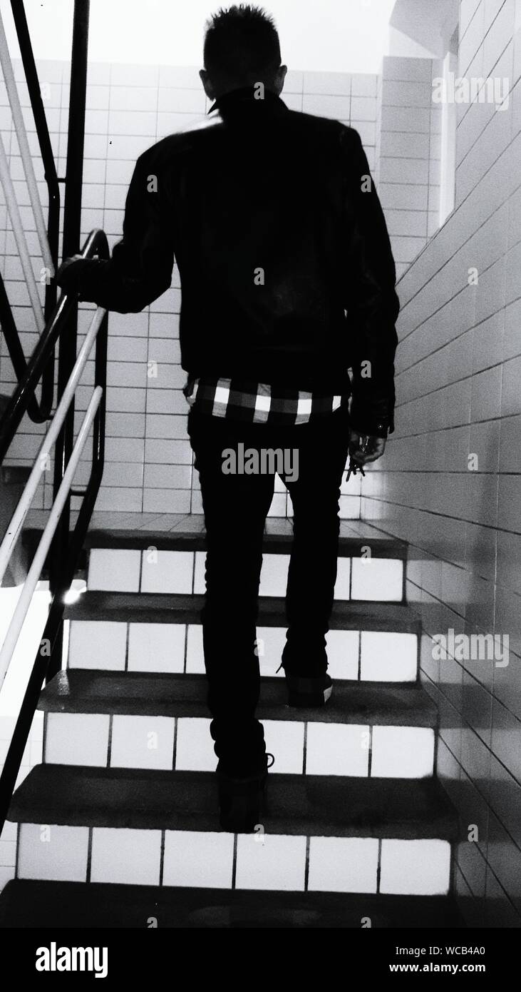 Man moving up stairs hi-res stock photography and images - Alamy