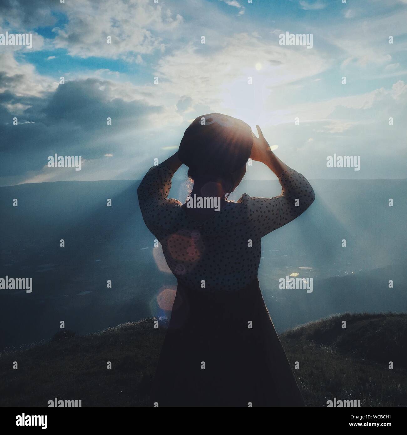 Person shielding eyes from the sun hi-res stock photography and images ...