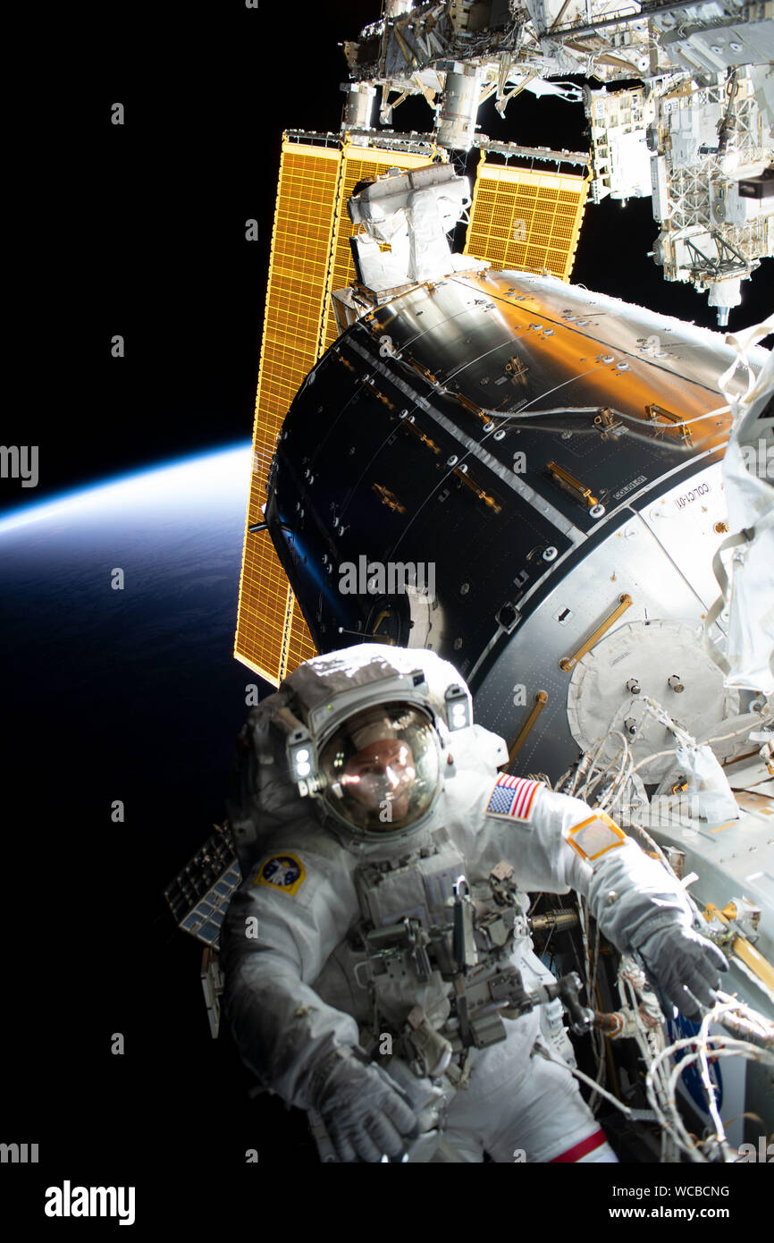 NASA astronaut Nick Hague takes a selfie during a spacewalk outside the ...