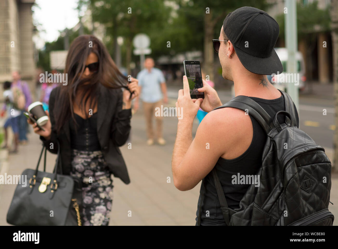 Man photographing woman hi-res stock photography and images - Alamy