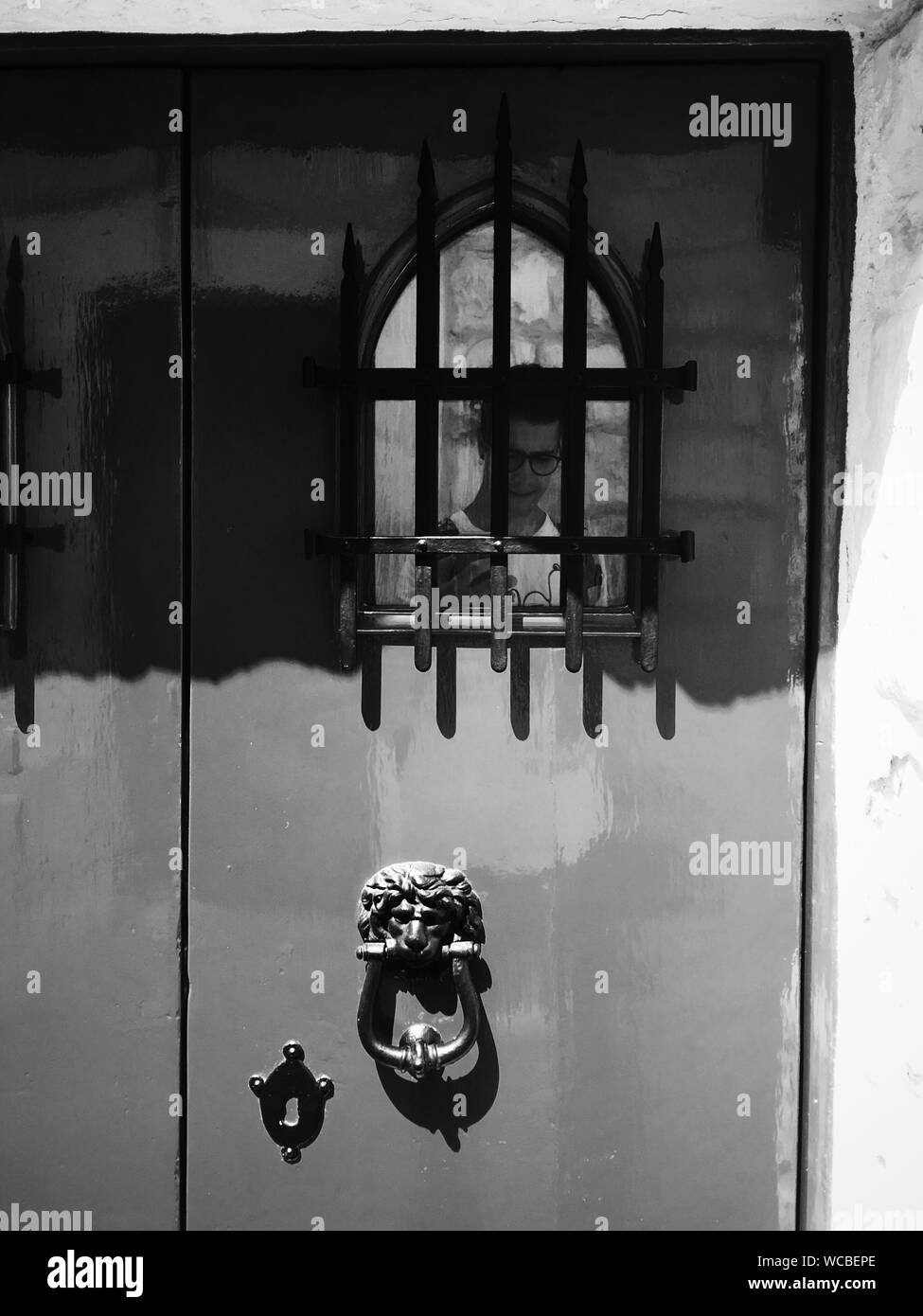 Standing behind door hi-res stock photography and images - Alamy