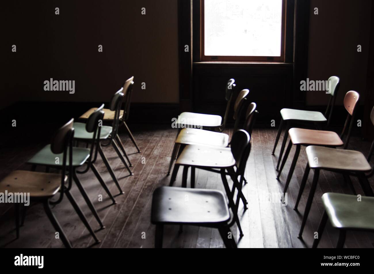 Empty Chairs In Room Stock Photo - Alamy