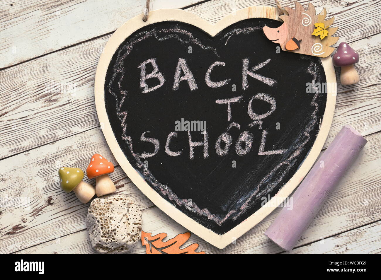 Back to school concept. Handwritten with chalk on the heart shaped ...