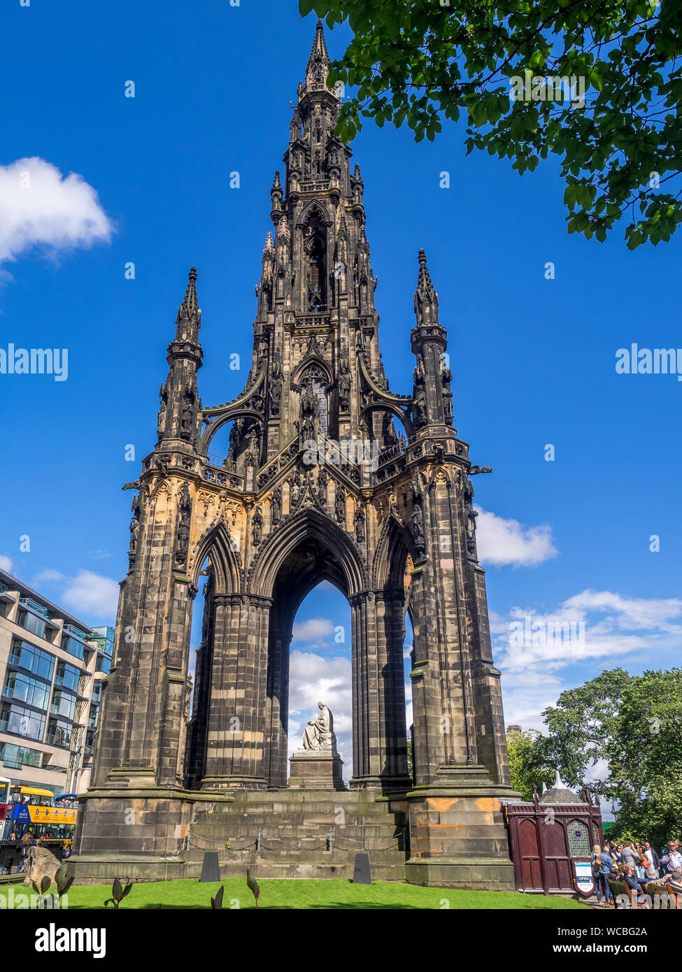 Statue of Sr Walter Scott at the base of the Scott Monument at night on ...