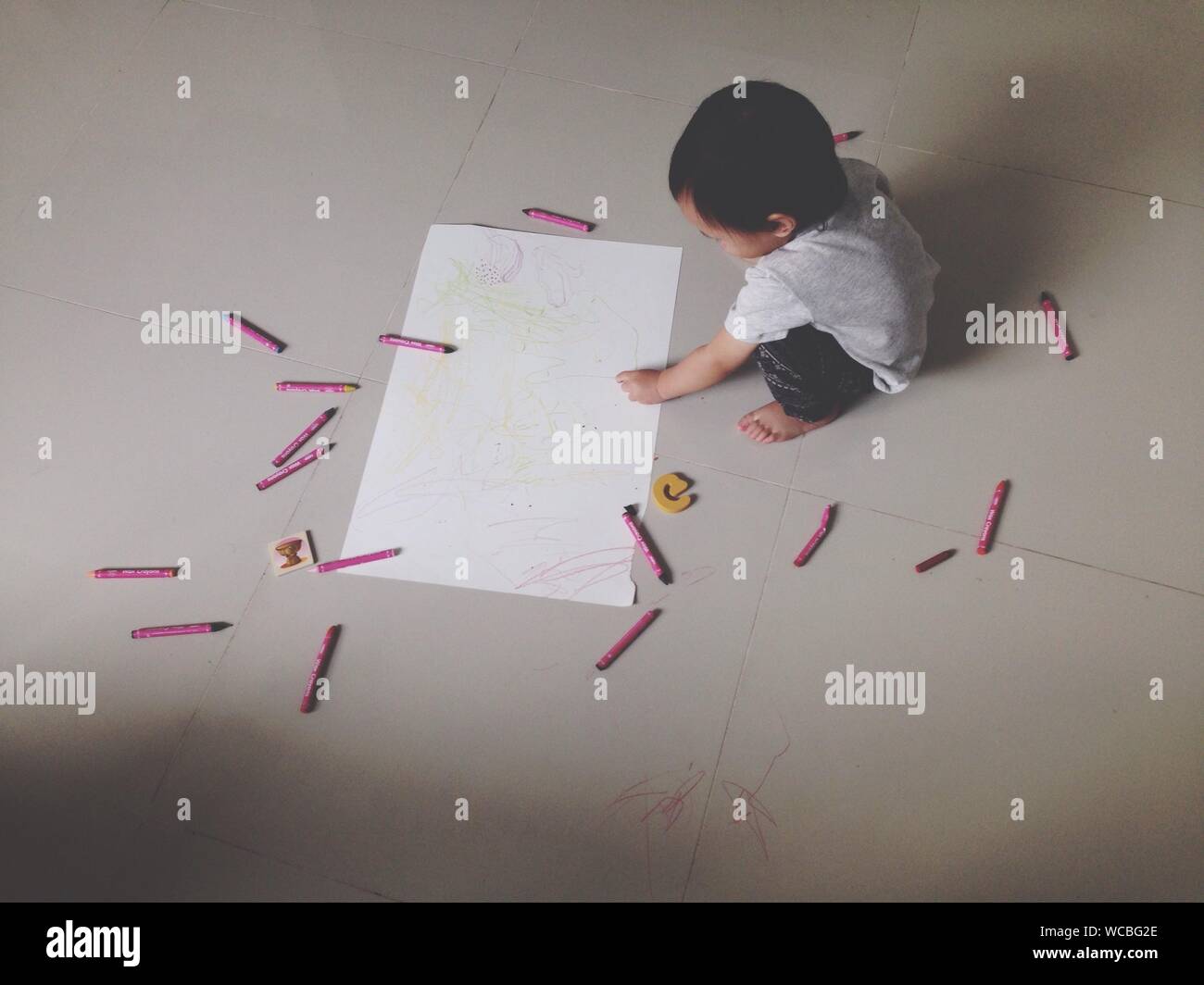 Boy drawing crayons hi-res stock photography and images - Alamy