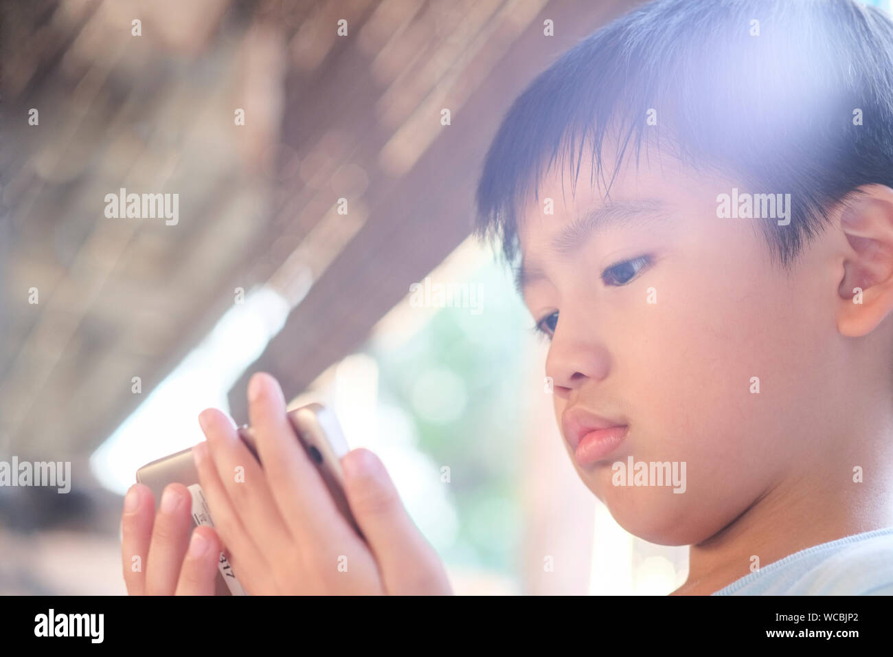 Indian boy using technology hi-res stock photography and images - Alamy